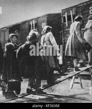 This historical photograph shows the deportation of Jewish individuals ...