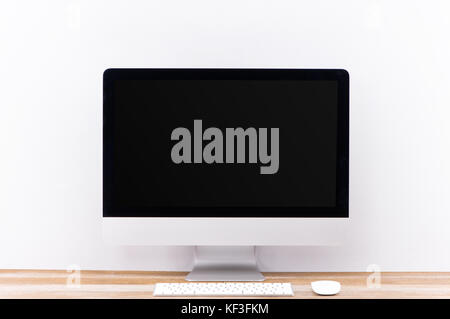 work place concept : mock up blank screen computer desktop with keyboard with a view out of the ...