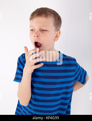 Little boy yawning Stock Photo - Alamy