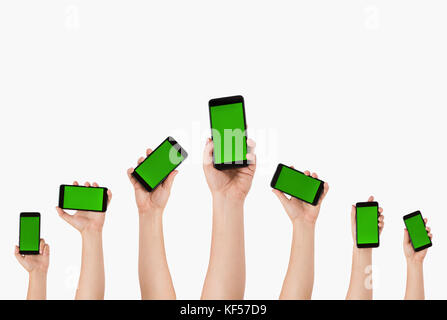 Group of people with devices in hands working together as symbol of ...