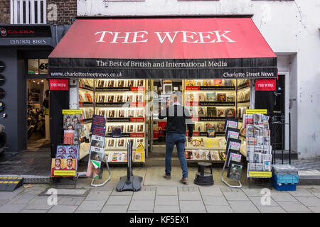 Magazines on display in a newsagent store Stock Photo - Alamy