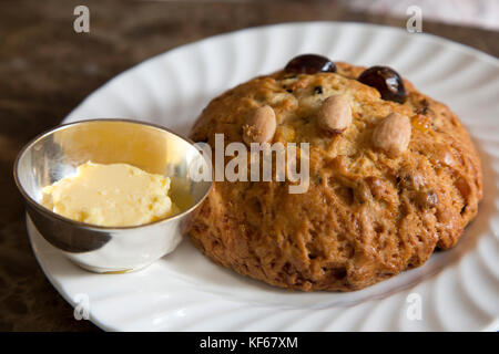 A Yorkshire Fat Rascal served with butter at Bettys Cafe Tea Room in ...