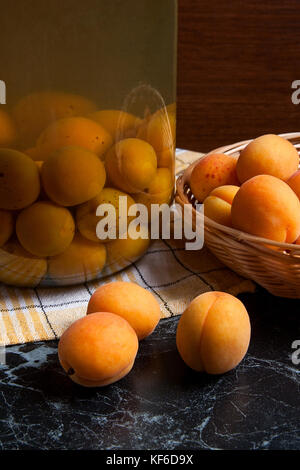 Big ripe apricots in basket. Juicy, soft fruit,, of an orange-yellow ...