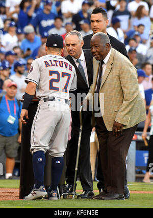 Houston Astros' Jose Altuve, right, scores as Seattle Mariners catcher ...