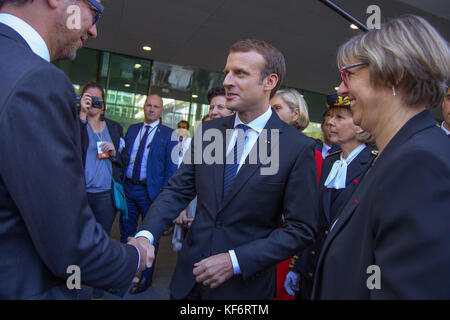 French President Emmanuel Macron shaking hands with the finalists ...