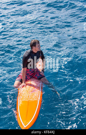 The lifestyle of a rider. High angle shot of biker gear against a gray ...
