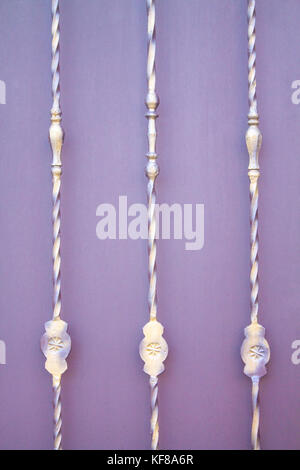 Metal patterns on a twisted metal rod on a purple background Stock ...