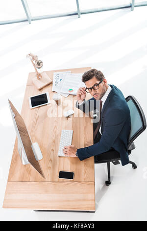 Tablet computer, eyeglasses and newspaper on white background. Concept ...