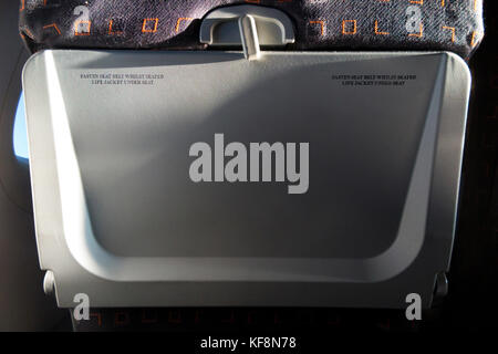 Passenger seat tray table in the full upright position on an Airbus ...