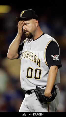 Los Angeles Dodgers' Jason Repko is hit in the elbow by a pitch by ...