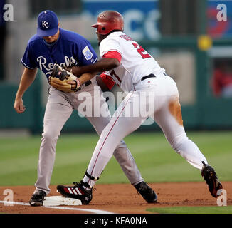 Kansas City Royals' Mark Teahen (24) dives back to first base with ...