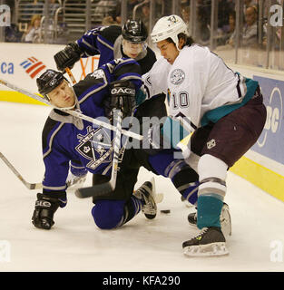 Anaheim Mighty Ducks Jason Krog, (R) is checked by Colorado Avalanche's ...