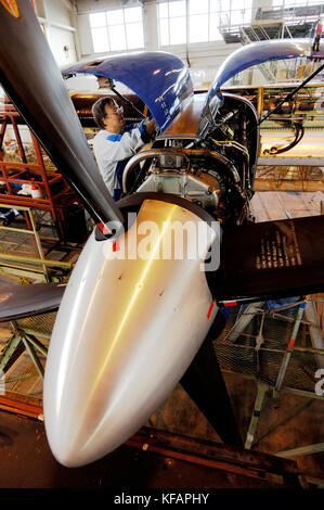man working on a PW124B turboprop engine on an Aero Airlines ATR 72-200 ...