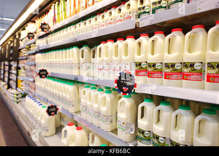 Fresh British milk on the shelves of a marks and spencer foodhall along ...