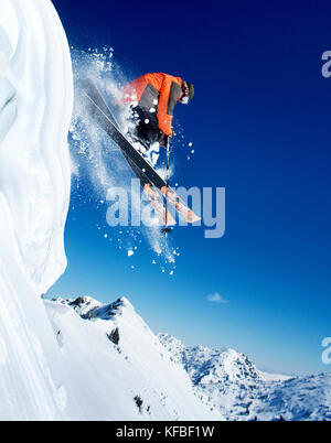 USA, Utah, person getting air in East Greely Bowl, Alta Ski Resort ...