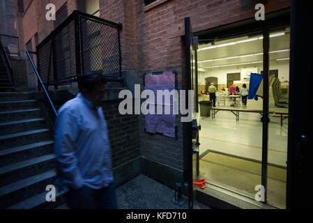 A voter walks past a voting booth before casts her ballot, Tuesday ...