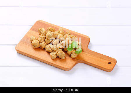 pile of soy meat cubes on wooden cutting board Stock Photo - Alamy