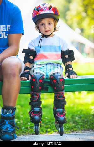 cute boy sitting at the skate park Stock Photo - Alamy