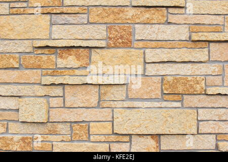 Modern Limestone (Kasota Stone) Brick Wall Background with Varying ...