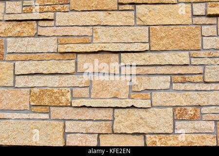 Modern Limestone (Kasota Stone) Brick Wall Background with Varying ...