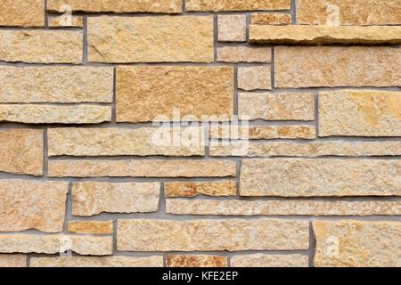 Modern Limestone (Kasota Stone) Brick Wall Background with Varying ...