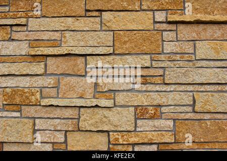 Modern Limestone (Kasota Stone) Brick Wall Background with Varying ...