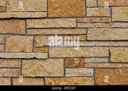 Modern Limestone (Kasota Stone) Brick Wall Background with Varying ...