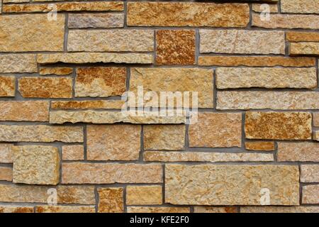 Modern Limestone (Kasota Stone) Brick Wall Background with Varying ...