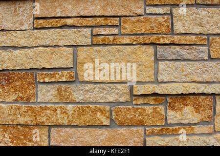 Modern Limestone (Kasota Stone) Brick Wall Background with Varying ...