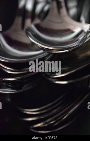 abstract stacked spoons in a cutlery rack Stock Photo - Alamy