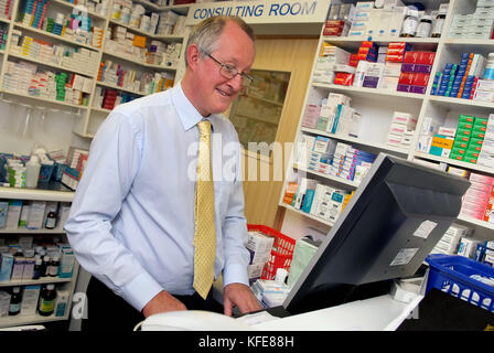 Pharmacy dispenser Chris Badham Stock Photo - Alamy