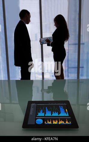 Silhouette of young businesswoman with clipboard on white background ...