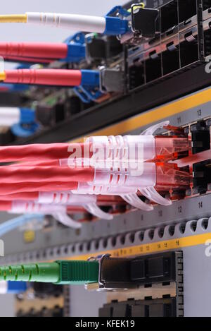 System administrator in data center, solving tasks on tablet while running programming scripts ...