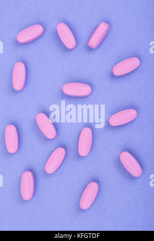 Colored medical capsules on bright background Stock Photo - Alamy
