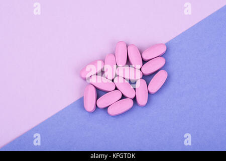 Colored medical capsules on bright background Stock Photo - Alamy