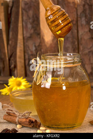 healthy eating concept, almonds, pine nuts, walnuts and a glass of milk ...