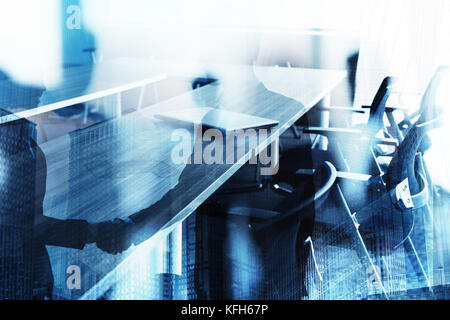 Abstract business handshake background with meeting room and blurred ...