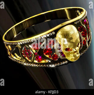 Jewelry gold skull ring with diamond and red ruby gems Stock Photo - Alamy