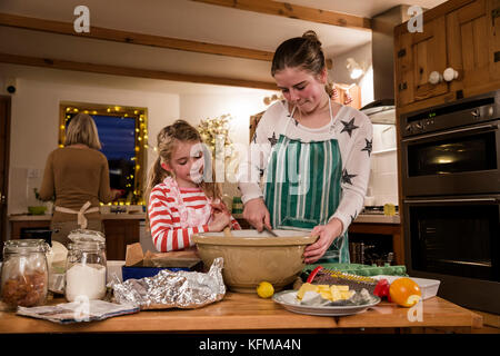 Sisters baking in the kitchen Stock Photo - Alamy