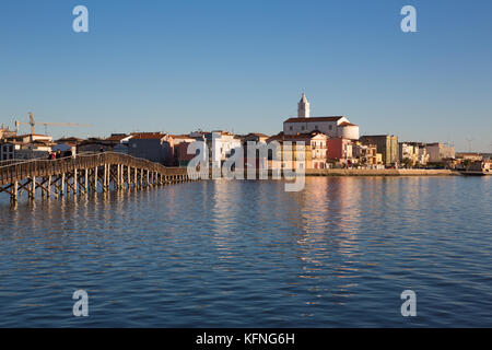 Lesina (Puglia, Italy) - Lesina Lake and the village in the sunset ...