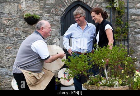Legendary Bodhran maker Malachy Kearns showing his drums to tourists ...