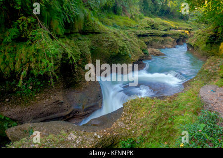 Water flows downstream to Devi's Falls in Pokhara, Nepal Stock Photo ...