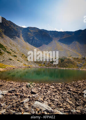 Alpine high altitude glacial lake called Gangbal in Kashmir nestled in ...
