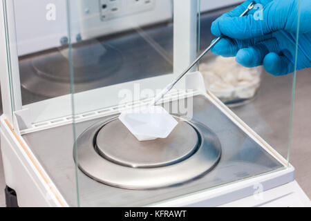 Scientist using an analytical balance at laboratory Stock Photo - Alamy