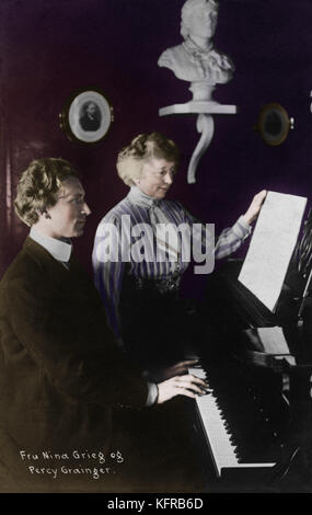 Percy Grainger playing the piano with Nina Grieg looking at the score ...