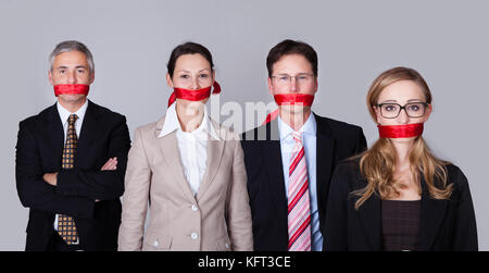 Male and female business people gagged and tied Stock Photo - Alamy