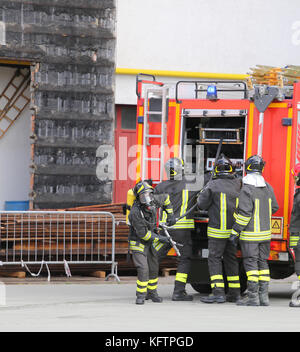 brave firefighters and their fire truck during a rescue mission Stock ...