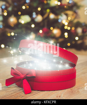 Sparkling Gift box with bow in woman's hands. Winter concept Stock ...