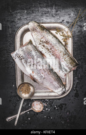 Raw tilapia fish fillet over board for cooking Stock Photo - Alamy