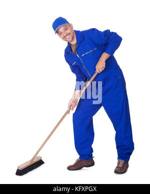 Sweeper worker staff sweeping cleaning with besom Stock Photo - Alamy